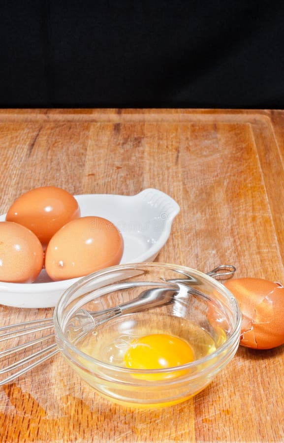 Glass Bowel of Egg with Whisk, Egg Shell and Three Brown Eggs Stock ...