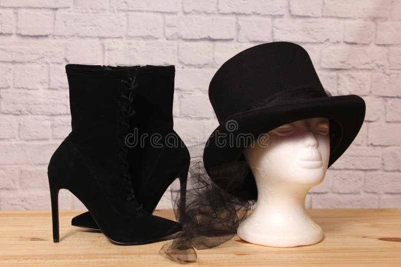 Top Hat and Vintage Boots Displayed in Thrift Store Stock Image - Image ...