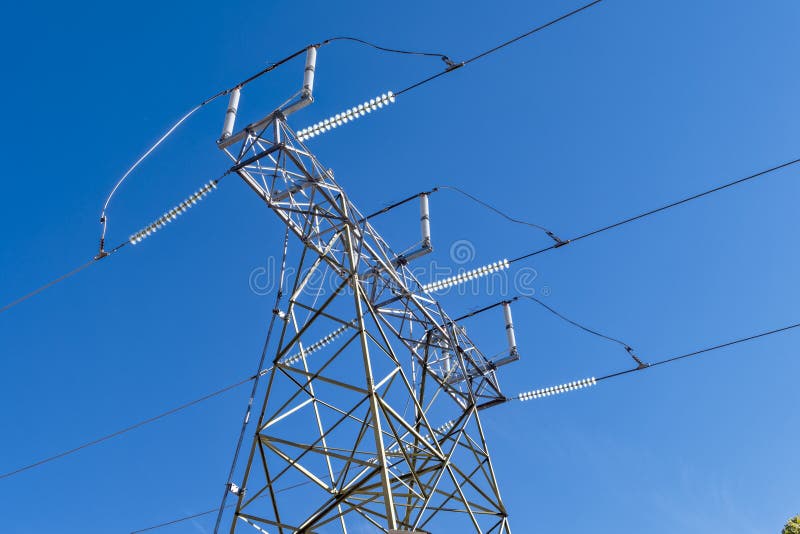 The Top of a High Tension Electrical Transmission Tower with Glass ...