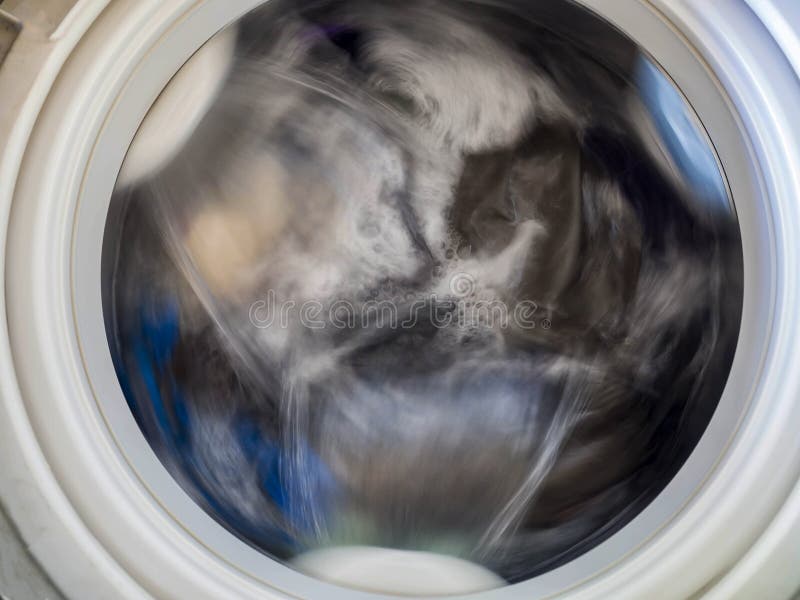 Top View of a Washing Machine Drum during Spinning Clothes. Top Loading ...