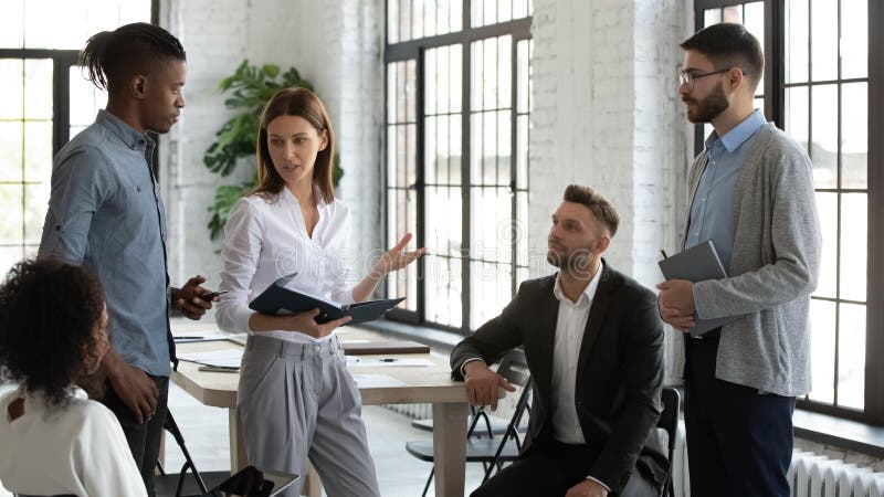 Manager and Employees Going Over Tasks during Briefing Stock Image ...