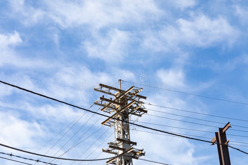 Top of an Old Metal Power Tower with Cables, Bright Blue Sky Copy Space ...