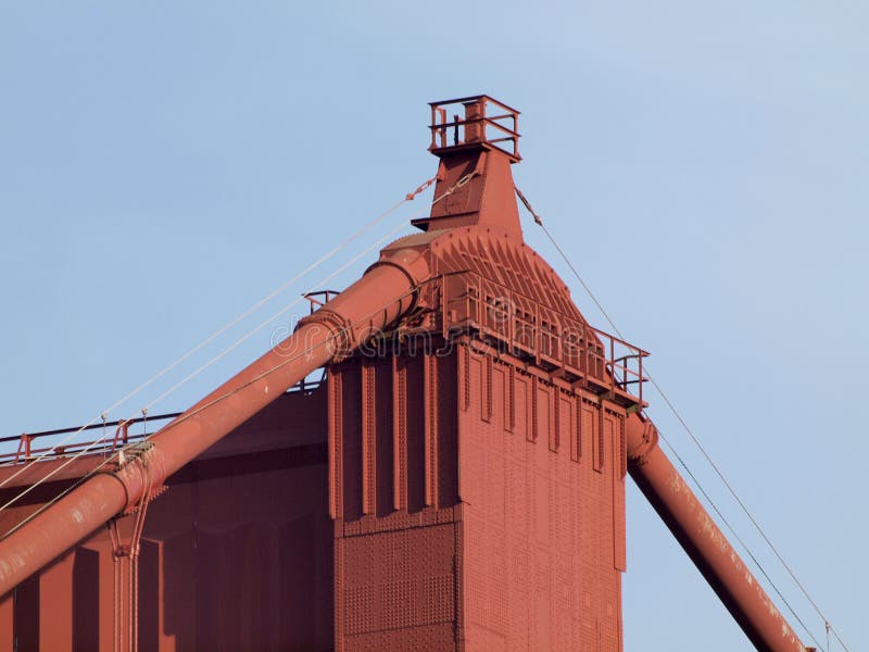 Top of Red Art Deco Tower and Supporting Cables Stock Photo - Image of ...