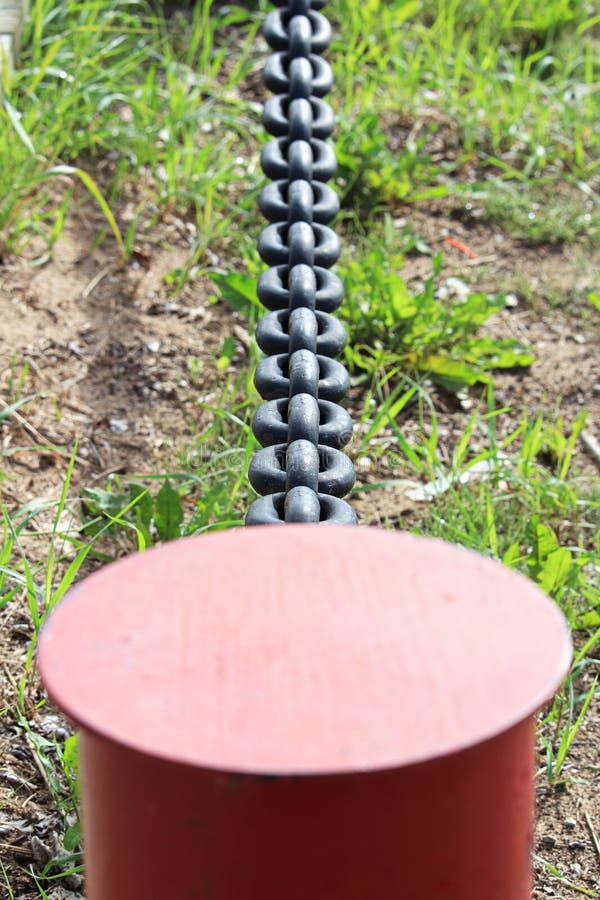 The Top of a Red Pole on a Chain Link Fence Stock Photo - Image of ...