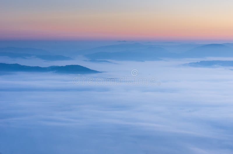 The Top of the Ridge in the Clouds. Deep Perspective. Sunset in the ...