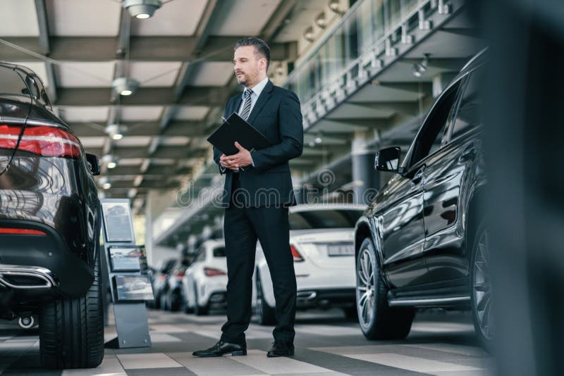 Top Sales Manager at Dealership Showroom Stock Photo - Image of ...