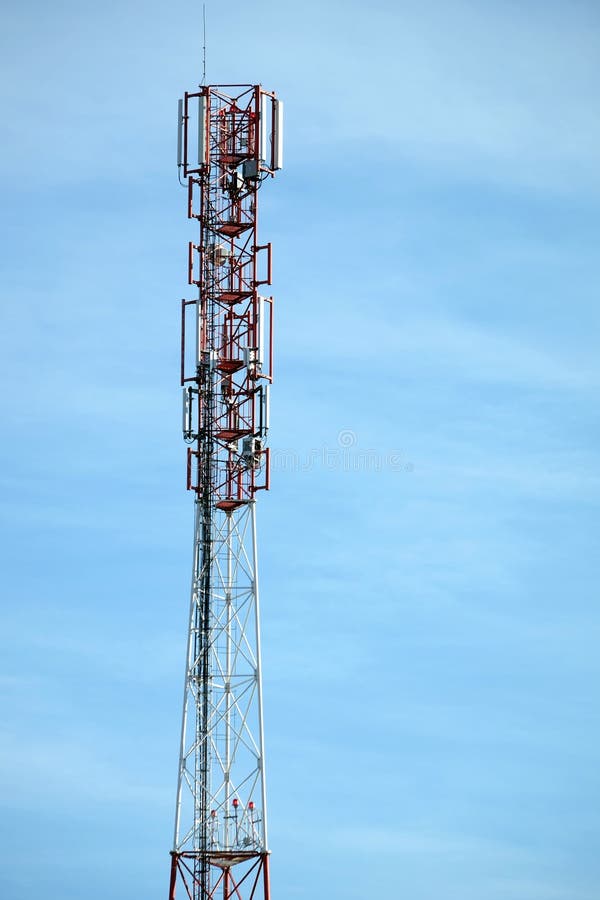 High Communication Tower with Round Antenna in a City Stock Photo ...