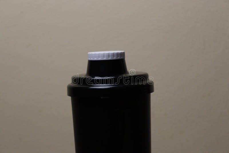 The Top of a Shaker that Has a White Cap and the Colour of the ...