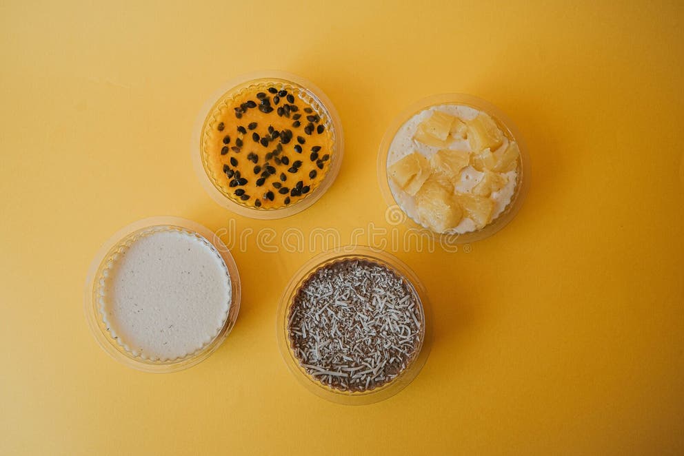Top Shot of Plastic Containers with Creamy Pudding with Various ...