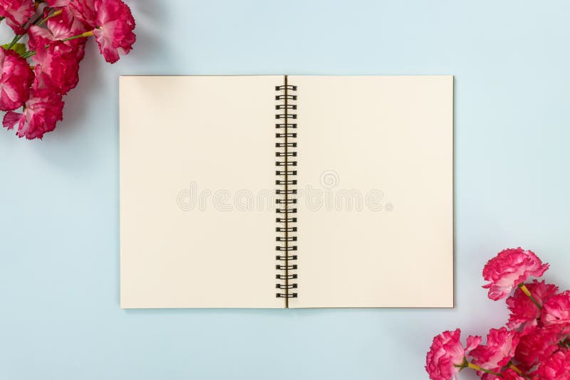 Top Table Spiral Notebook and Red Flowers at Bottom Right and Top Left ...