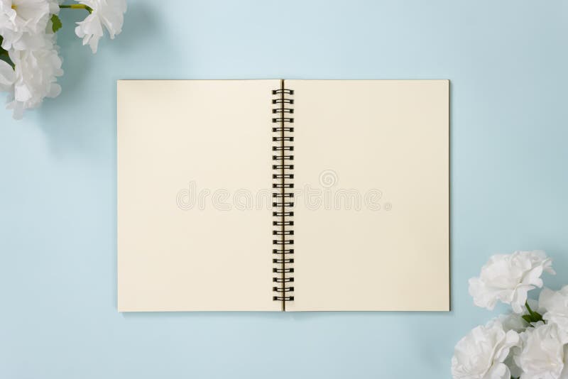 Top Table Spiral Notebook and White Flowers at Bottom Right and Top ...