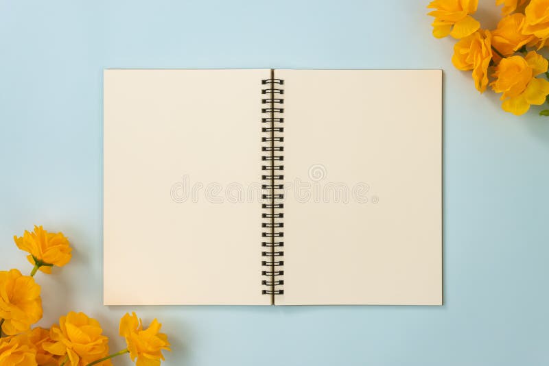 Top Table Spiral Notebook and Yellow Flowers at Bottom Left and Top ...