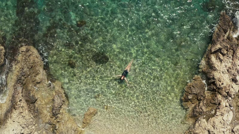 Top View Aerial Girl Jumping Into The Ocean Stock Footage Video Of