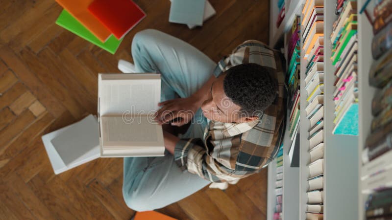 Top View African American Man Looking at Camera Reading Book Preparing ...
