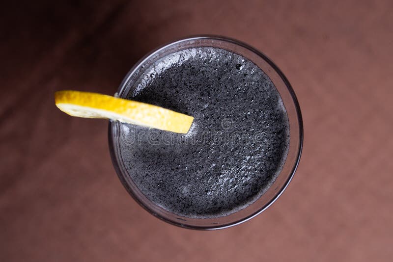 Top View of an Alcoholic Drink with Coca-Cola and a Slice of Lemon in a ...