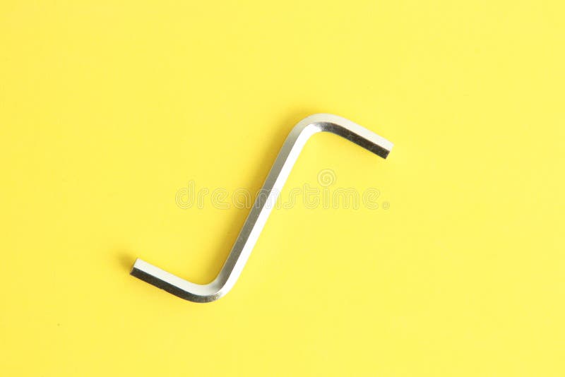 Top View of an Allen Key for Assembling Furniture on Yellow Background ...