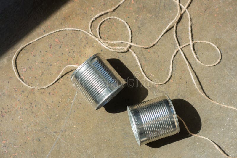 Top View of Aluminium Tin Cans Connected with Rope on the Ground Stock ...