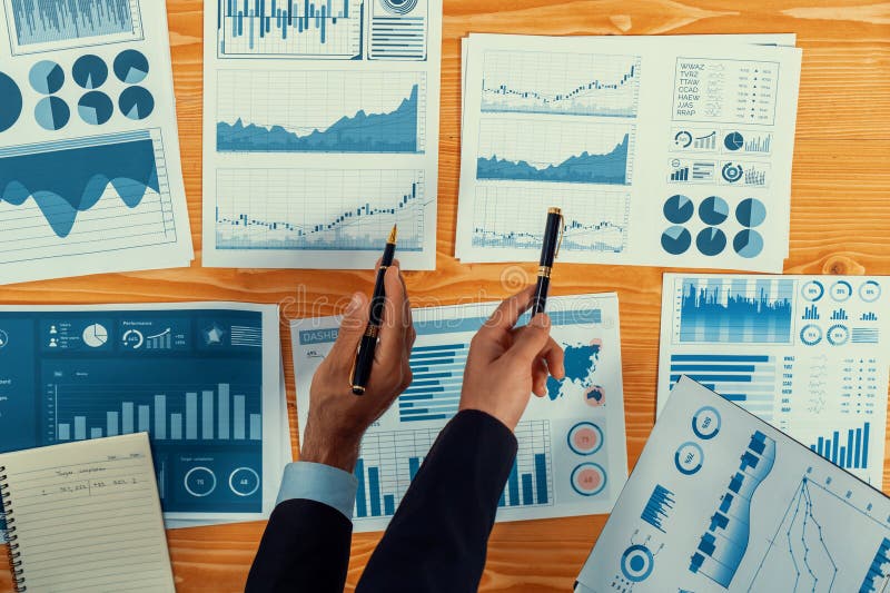 Top View Analyst Team Working on Dashboard Paper on Table. Fervent ...