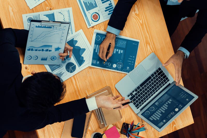 Top View Analyst Team Working on Dashboard Paper on Table. Fervent ...