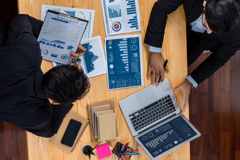 Top View Analyst Team Working on Dashboard Paper on Table. Fervent ...