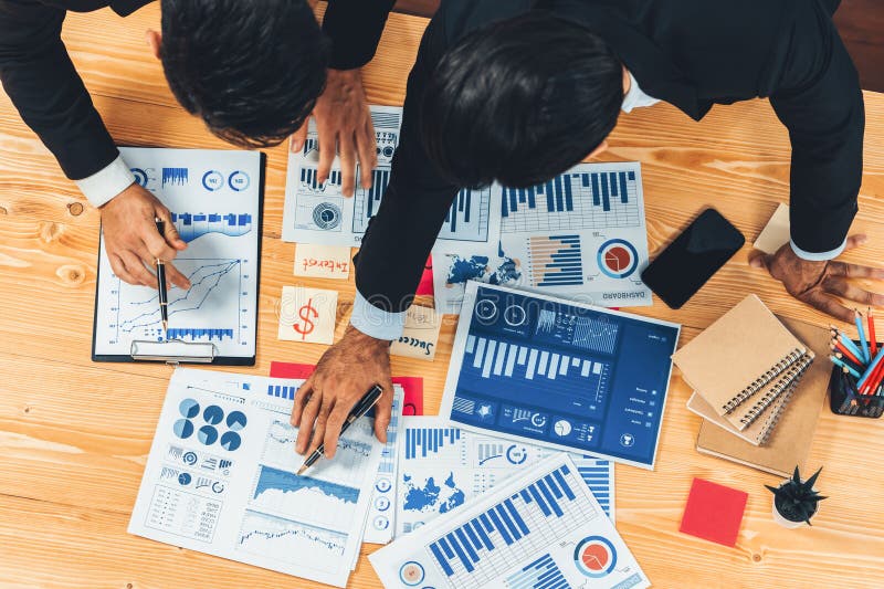 Top View Analyst Team Working on Dashboard Paper on Table. Fervent ...