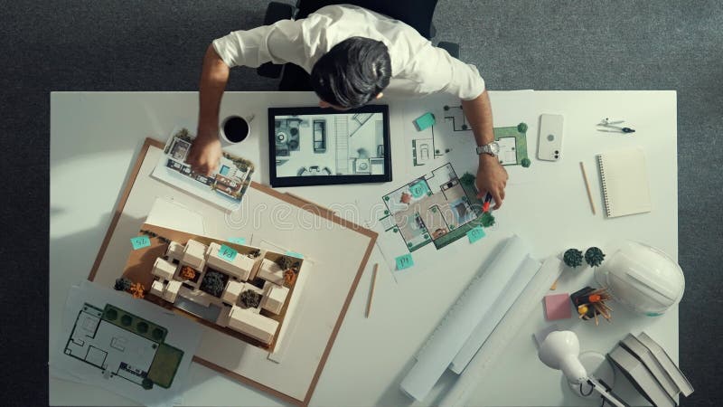 Top View of Architect Engineer Looking House Model and Blueprint ...