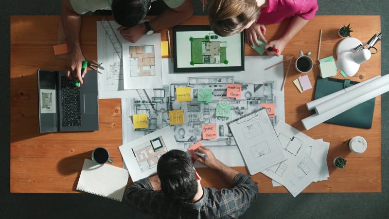 Top View of Architect Writing Idea at Sticky Note at Meeting Table ...