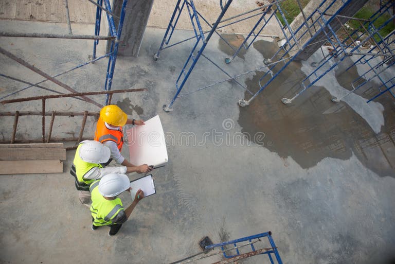 Top View of Architects Engineer are Discussing about the Progress of ...