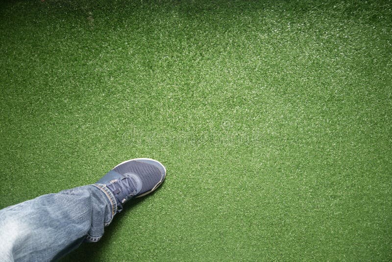 Top View of Artificial Green Grass Texture with Foot Entering from ...