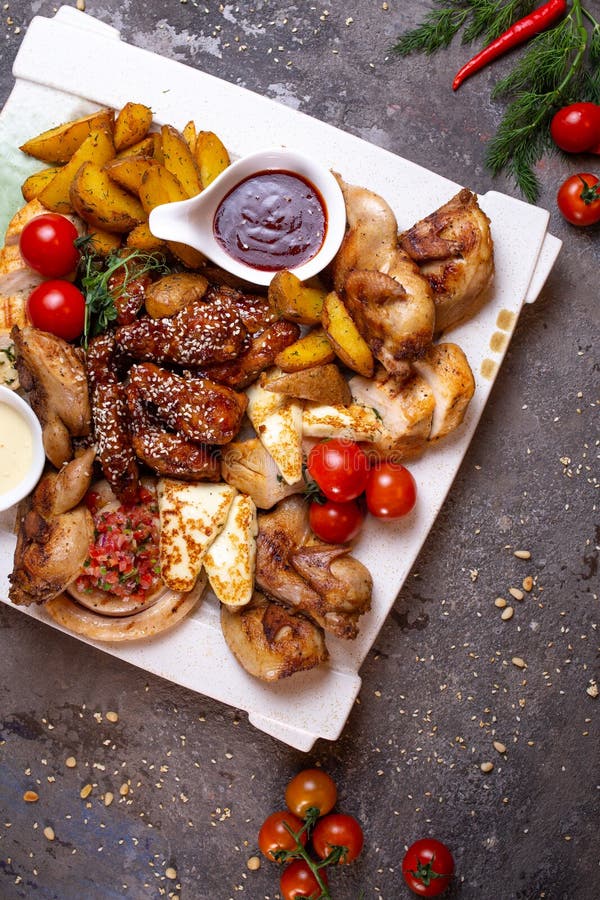 Top View of Assorted Different Chicken Dishes on a White Plate Stock ...