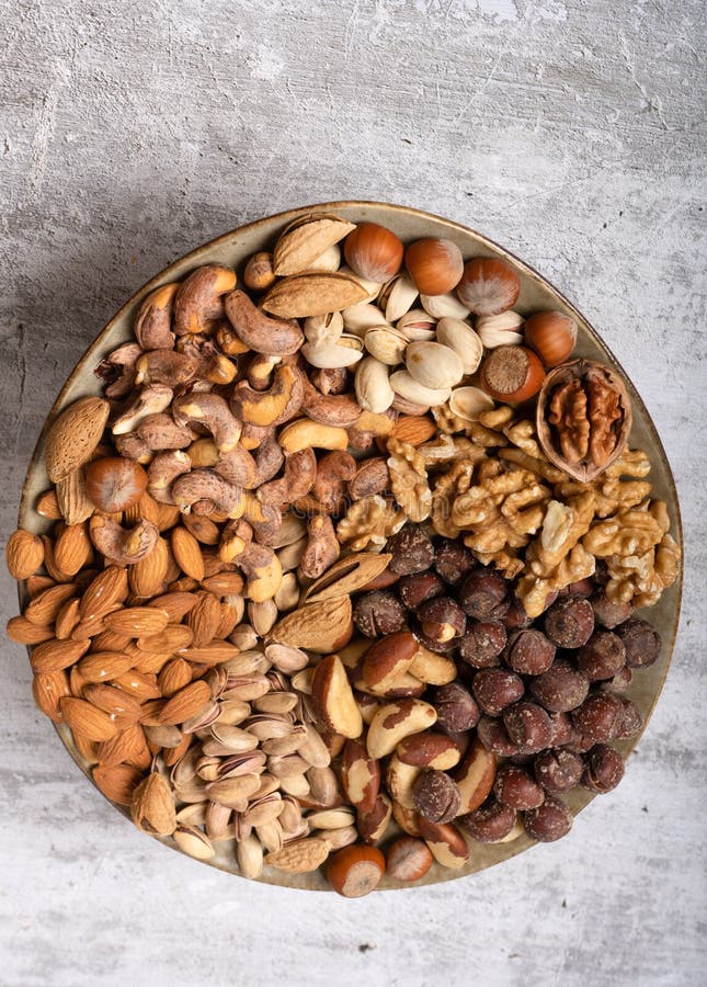 Top View of Assorted Different Types of Nuts on a Plate Stock Photo ...