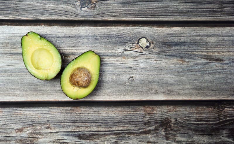 Top View Avocado Cut on Wooden Table Stock Photo - Image of vegetarian ...