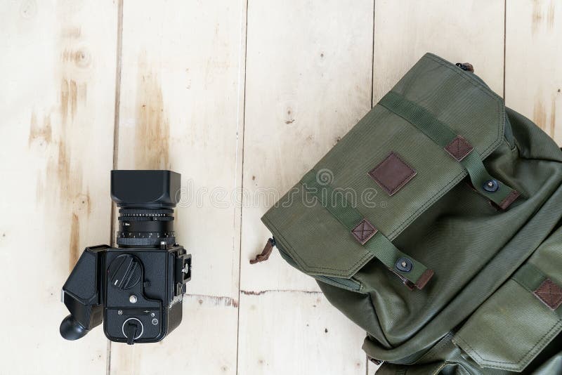 Top View of a Backpack and a Camera on the Wooden Surface - Travel ...