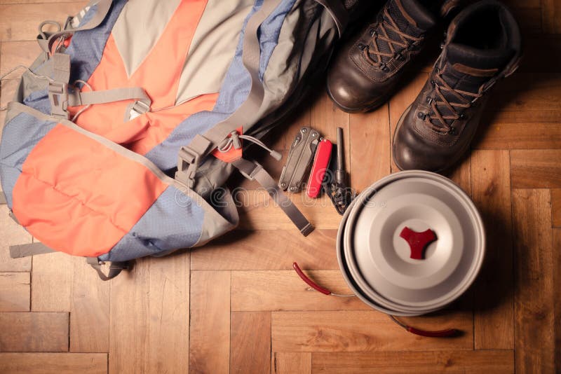 Top View of a Backpack, Footwear, and Hiking Equipment on the Floor ...