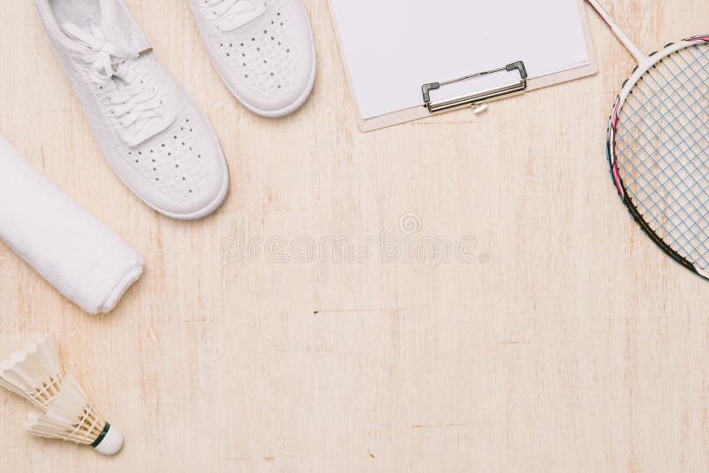 Top View of Badminton Racket with Shuttercocks in Row and Sneakers on ...