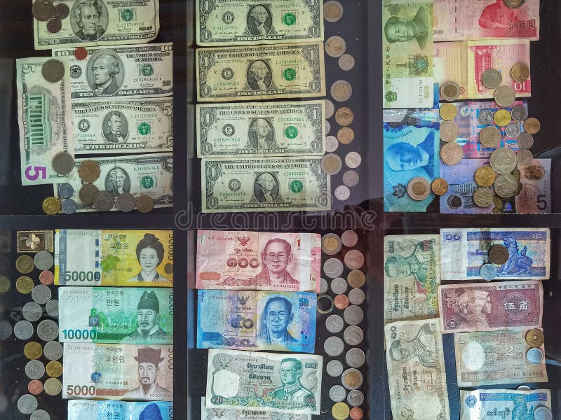Top View of Banknotes and Coins from Various Countries in the Glass ...