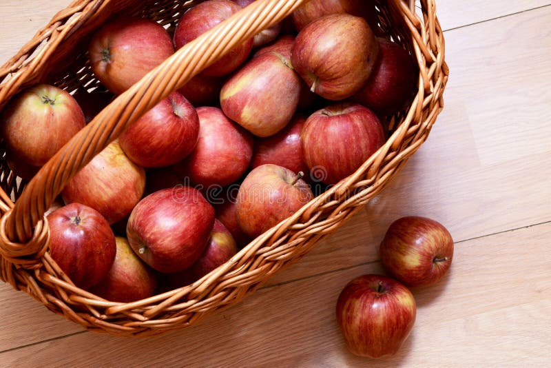 Top View of a Basket Full of Red Apples with Two Red Apples on the Side ...