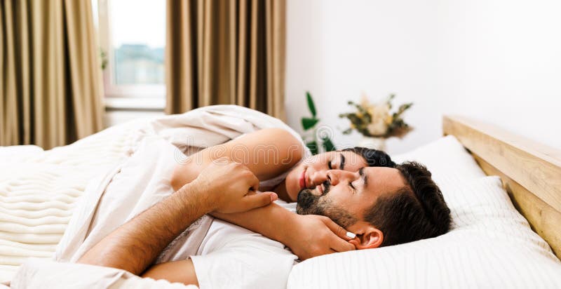 Top View of Beautiful Young Couple Sleeping Together and Hugging in Bed ... Top View of Beautiful Young Couple Sleeping Together and Hugging in Bed ...