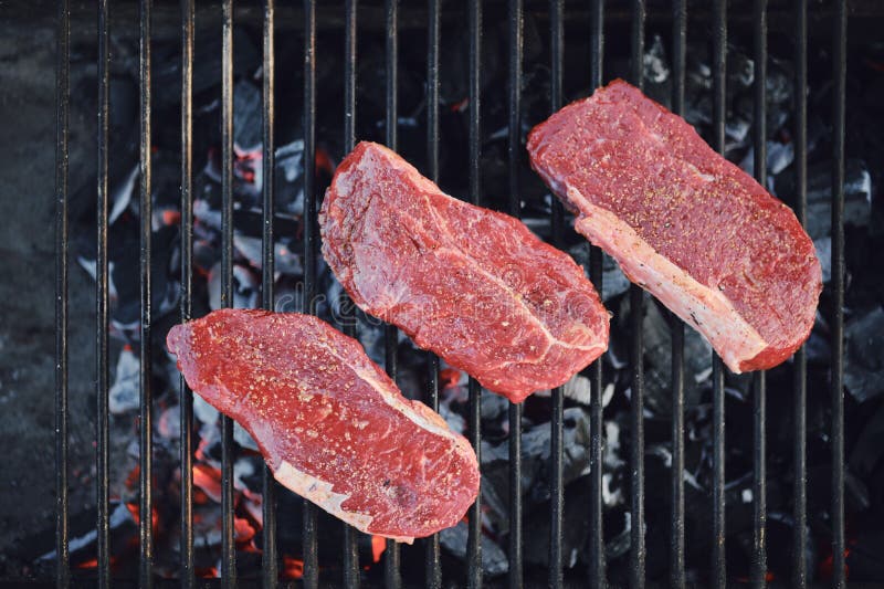 Top View of Beef Steaks on Grid of Grill Stock Image - Image of grill ...