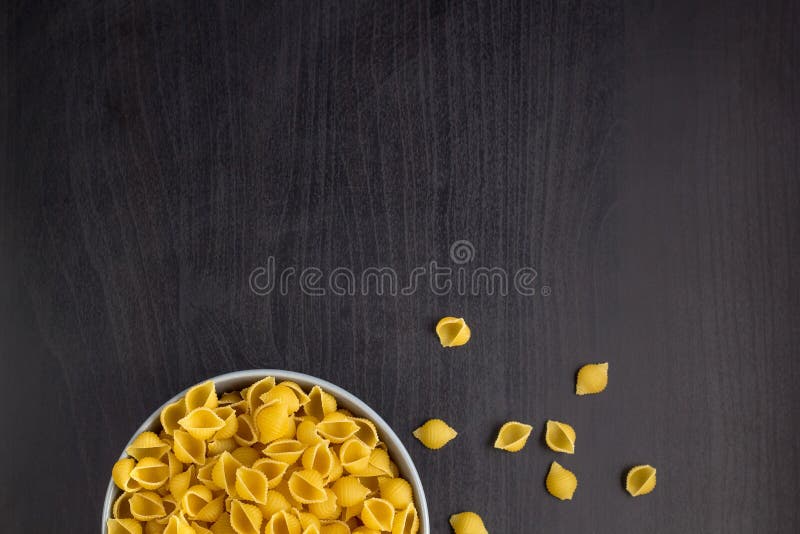 Top View of Black Background with Italian Raw Conchiglie Paste Shells ...