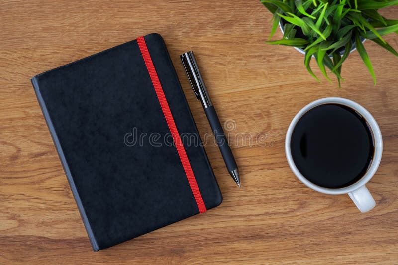 Top View of Black Closed Cover Blank Notebook with Coffee Cup and Pen ...
