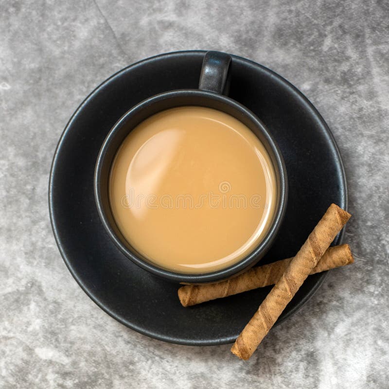 Top View of Black Cup of Coffee with Pastry on Grey Background Stock ...