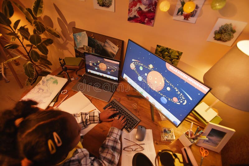 Top View at Black Girl Using Computer with Space Theme Studying at Home ...