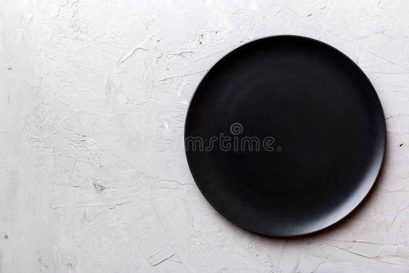 Top View of Black Plate on Cement Background. Empty Space for Your ...