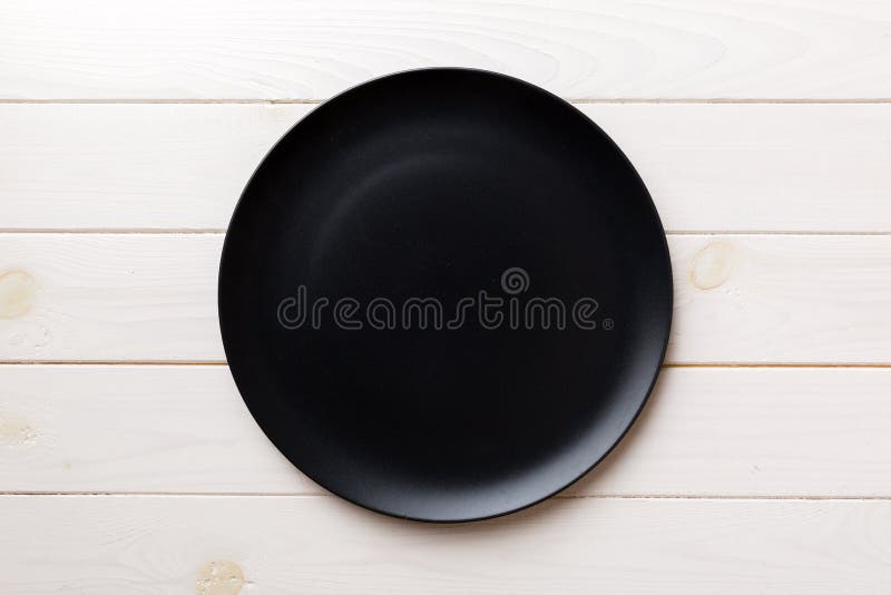 Top View of Black Plate on Wooden Background. Empty Space for Your ...