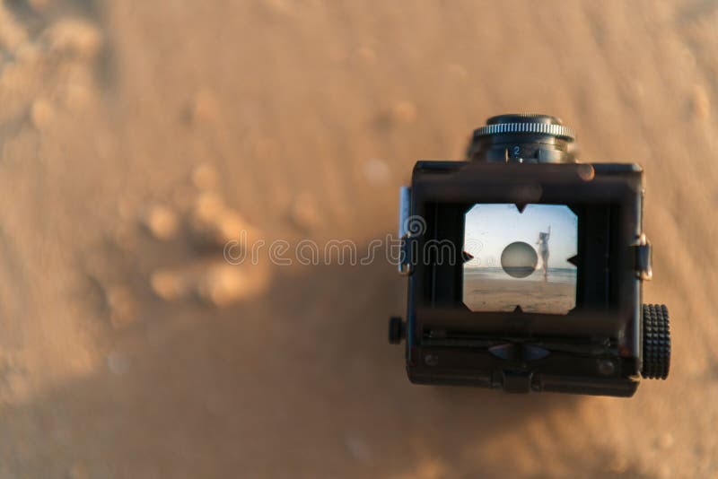 Top View of a Black Twin-lens Reflex Camera on the Sand Stock Photo ...