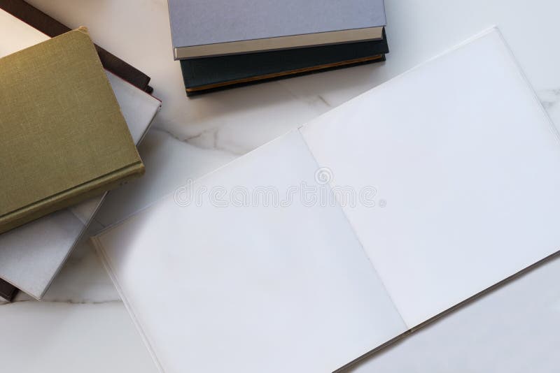 Blank Photo Book Page with Various Old Textbooks Stack on White Marble ...