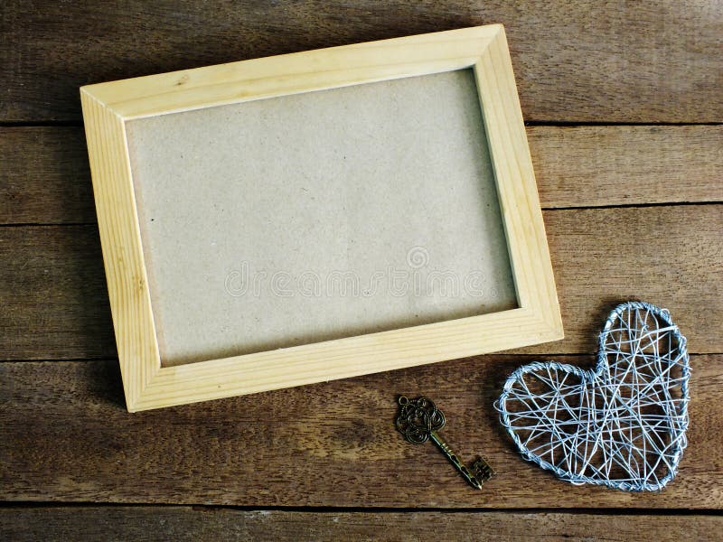 Blank Photo Frames on the Table Wooden Background Stock Photo - Image ...
