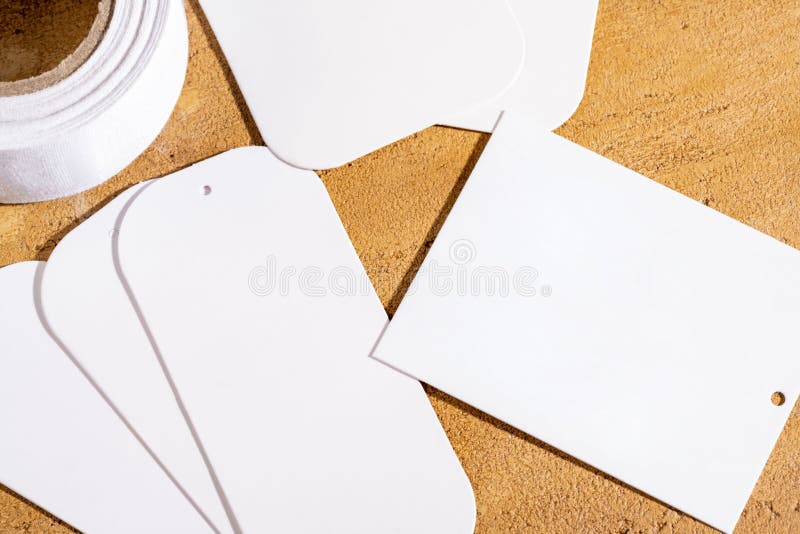 Top View of Blank White Cutout Tags with Copy Space on a Wooden Table ...