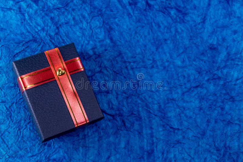 Top View of a Blue Gift Box on Textured Blue Surface and Copy Space ...